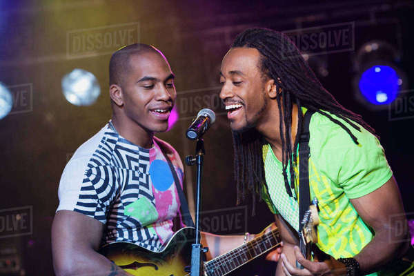 African men singing and playing guitar onstage - Royalty-free Stock ...