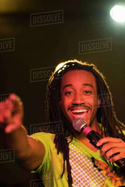 African man singing on stage - Royalty-free Stock Photo | Dissolve
