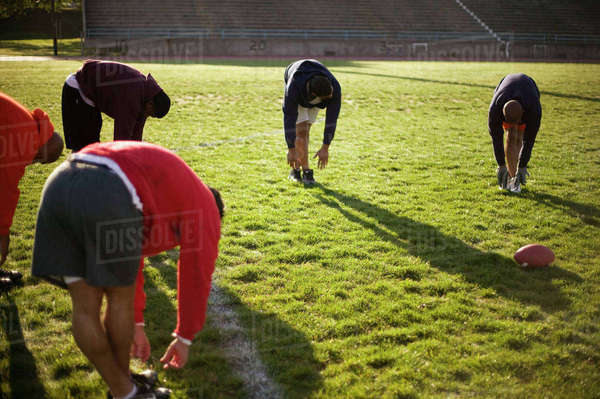 Men training on football field - Royalty-free Stock Photo | Dissolve
