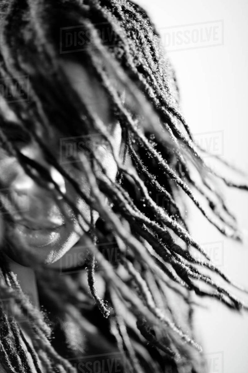Mixed race man with long dreadlocks - Royalty-free Stock Photo | Dissolve