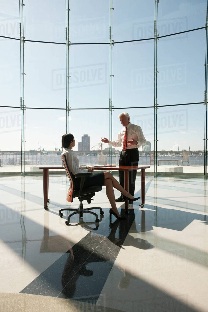 Business people working in large office with glass wall - Royalty-free ...