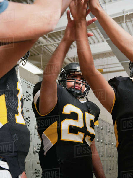 Football players celebrating in locker room - Royalty-free Stock Photo ...