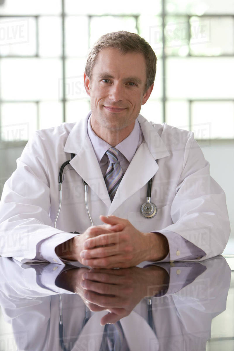 Smiling Caucasian doctor - Stock Photo - Dissolve