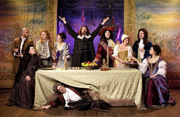 Actors in old-fashioned costumes on stage - Stock Photo - Dissolve