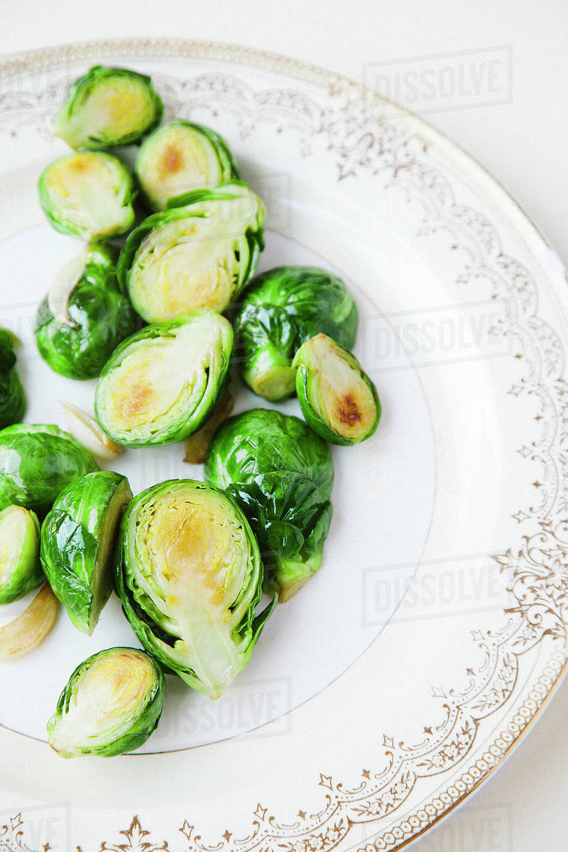 Sliced brussels sprouts on plate - Stock Photo - Dissolve