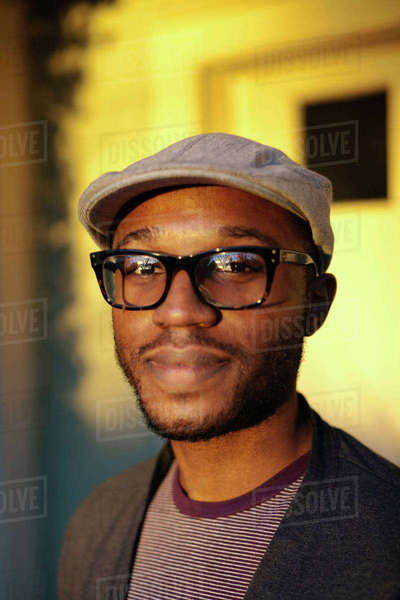 Smiling Black man standing outdoors - Royalty-free Stock Photo | Dissolve