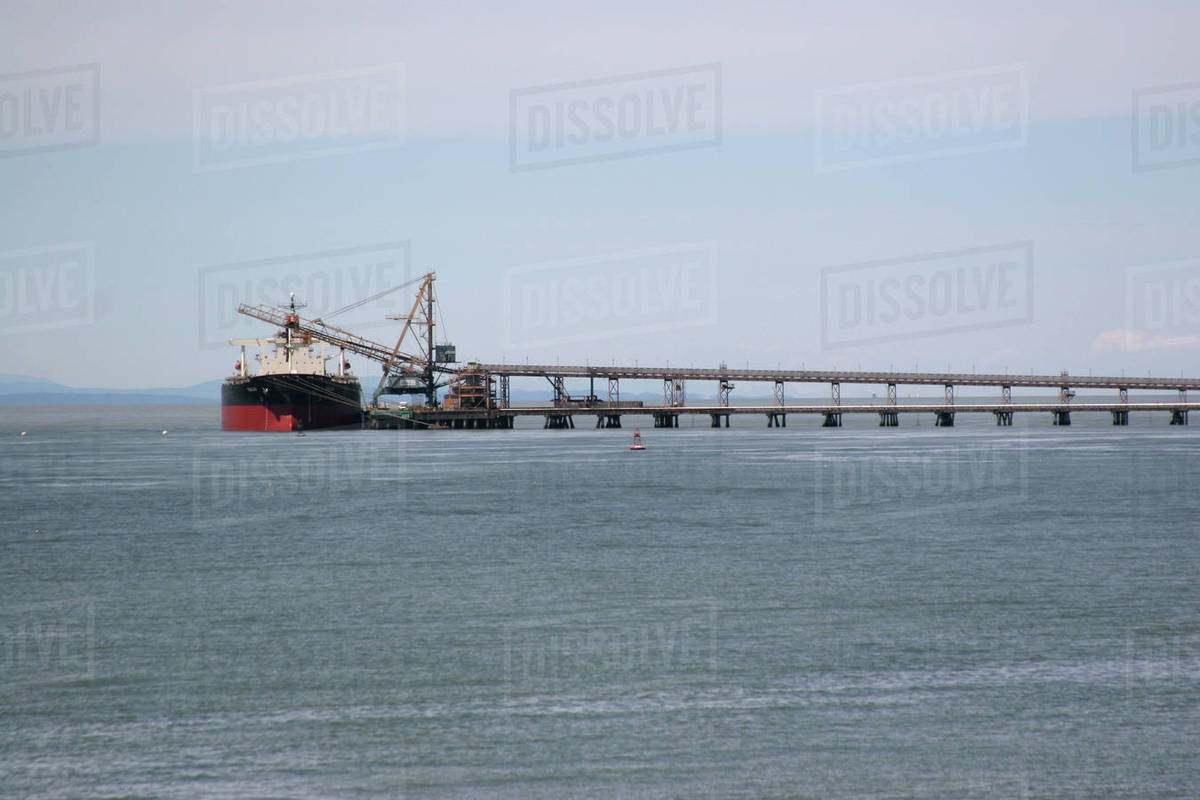 Container ship moored on dock - Royalty-free Stock Photo | Dissolve
