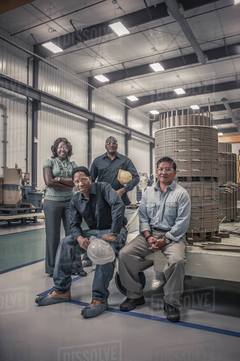 Workers together in factory - Royalty-free Stock Photo | Dissolve