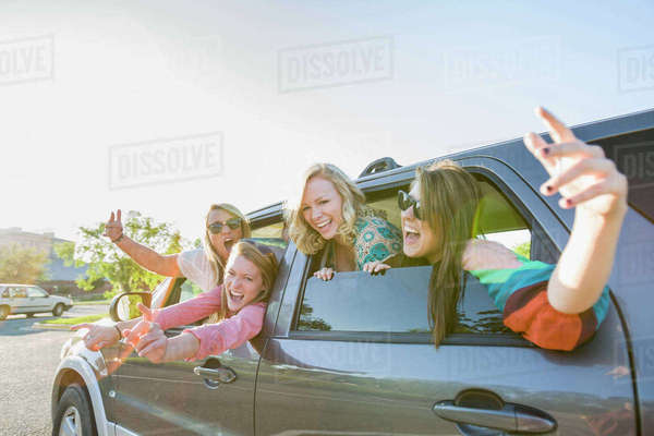 Playful friends in car - Stock Photo - Dissolve