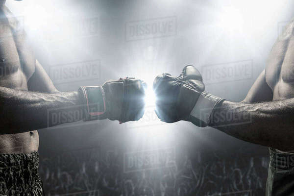 Boxers touching gloves before fight - Stock Photo - Dissolve