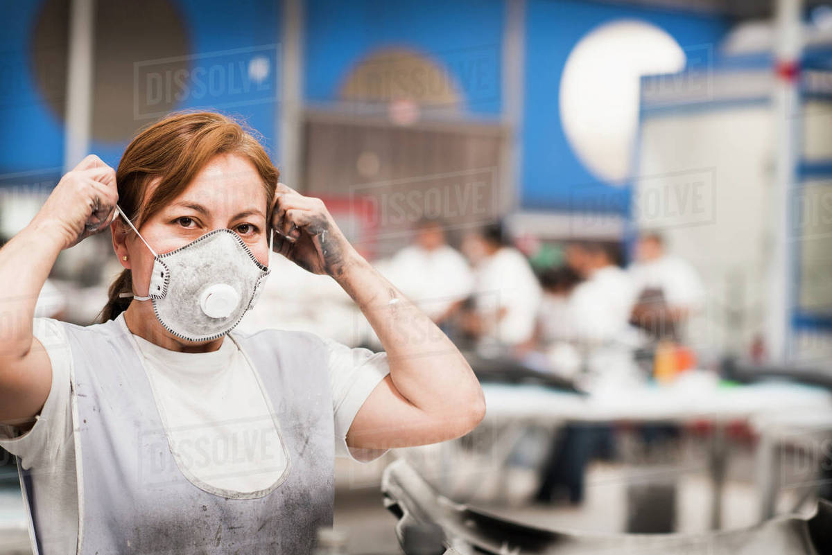 Worker wearing face mask in manufacturing plant - Royalty-free Stock ...