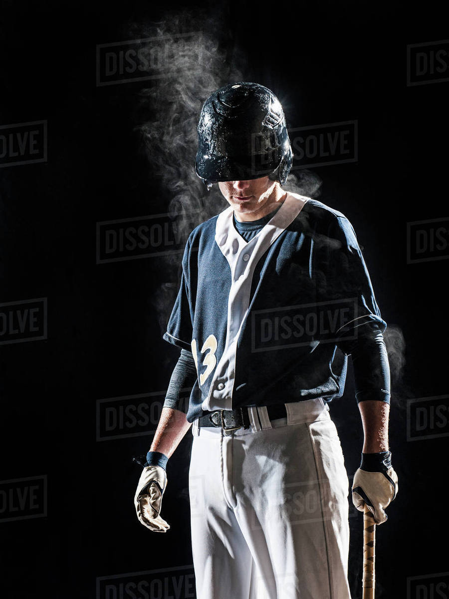 Caucasian baseball player standing under lights - Royalty-free Stock ...