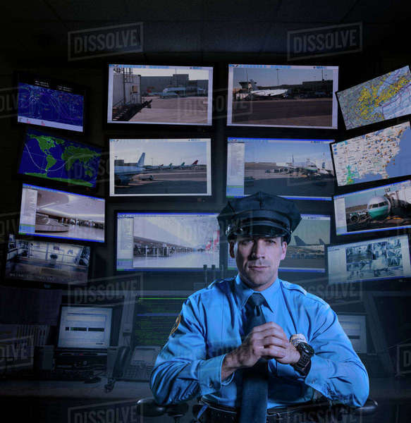Police officer working in control room - Royalty-free Stock Photo ...