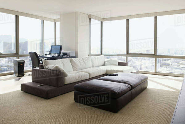 Living room and home office in luxury highrise apartment - Royalty-free ...
