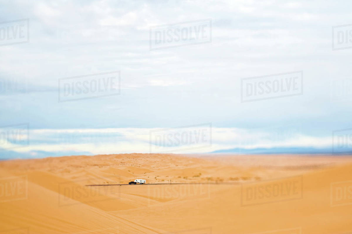 Truck Driving Through Desert - Royalty-free Stock Photo | Dissolve