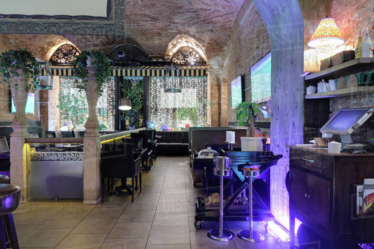 Restaurant interior lighted with purple - Stock Photo - Dissolve