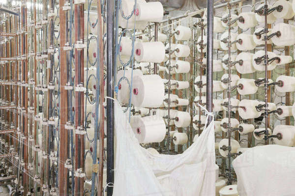 Spools in textile factory - Royalty-free Stock Photo | Dissolve