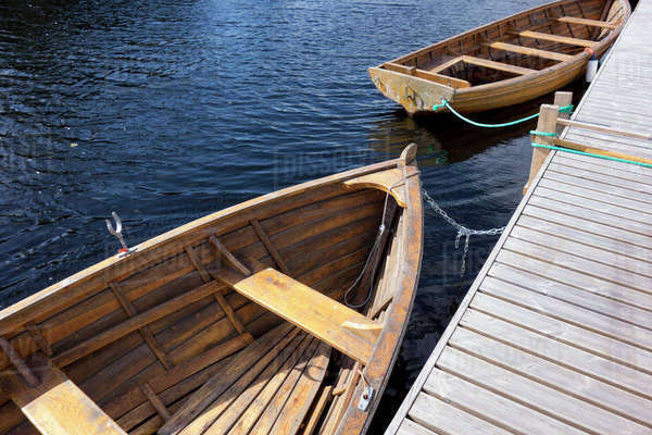 Wooden rowing boats moored - Royalty-free Stock Photo | Dissolve
