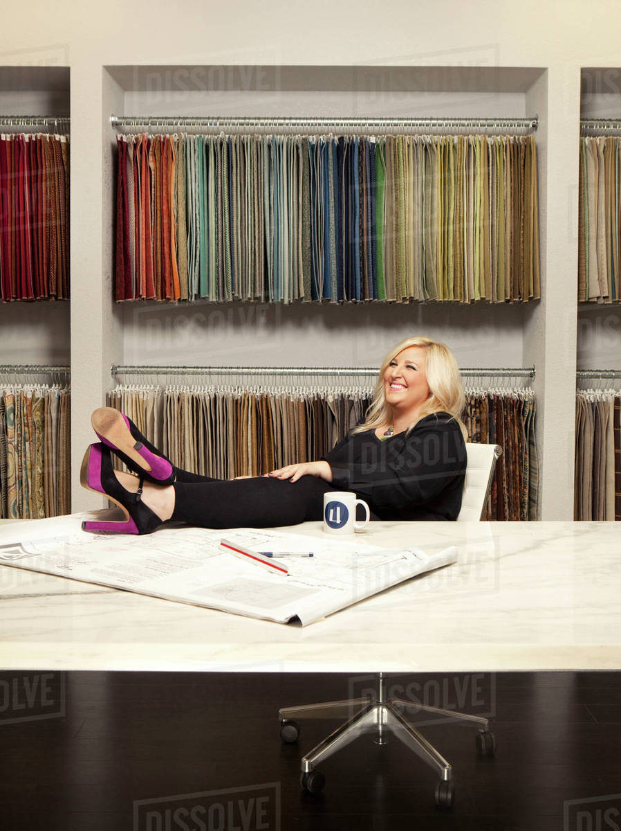 Caucasian interior designer sitting in studio - Royalty-free Stock ...