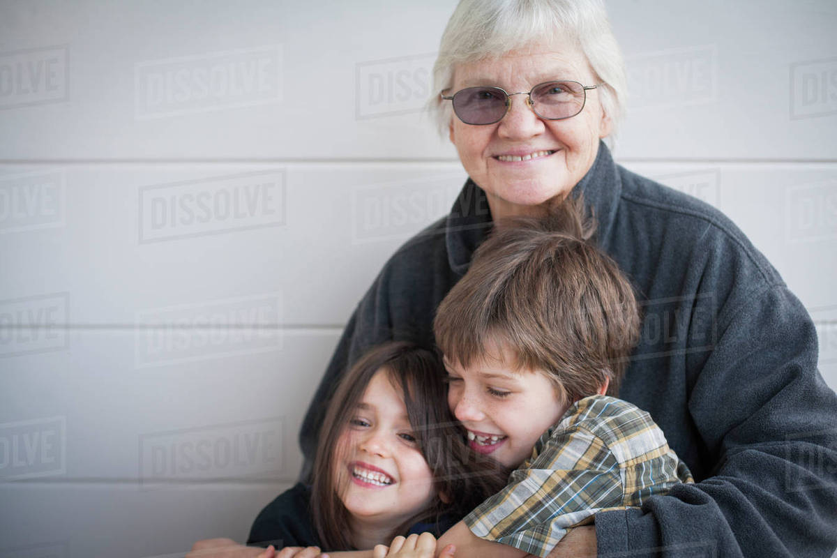 Caucasian grandmother and grandchildren smiling outdoors - Stock Photo ...