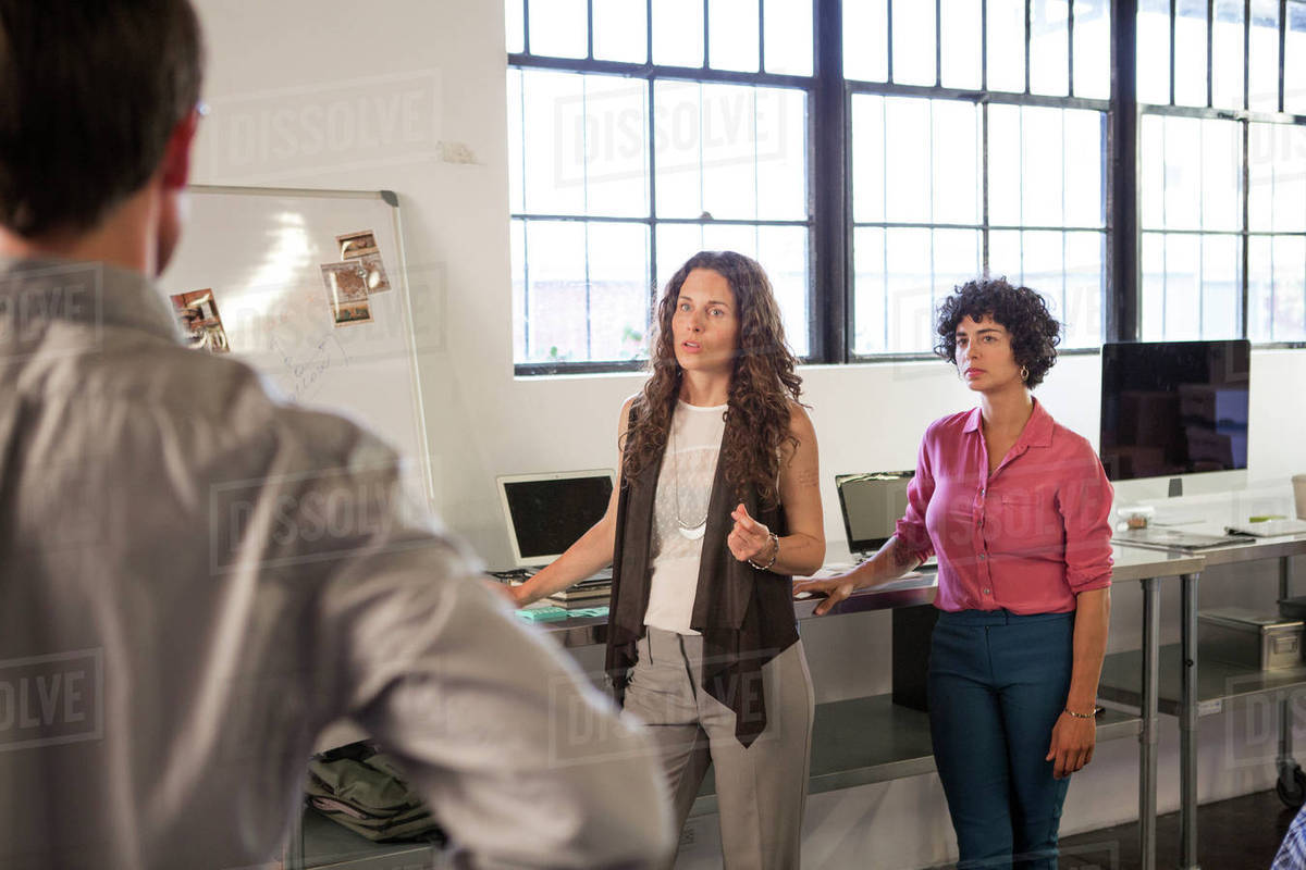 Business people talking in office - Royalty-free Stock Photo | Dissolve