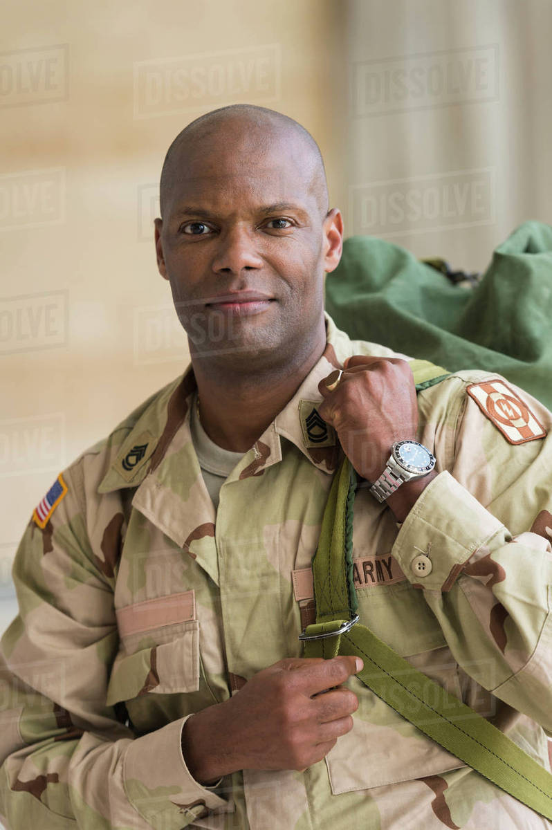 African American soldier carrying duffel bag - Royalty-free Stock Photo ...