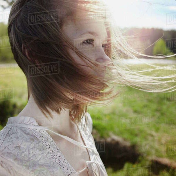 Caucasian girl with hair blowing in wind - Royalty-free Stock Photo ...