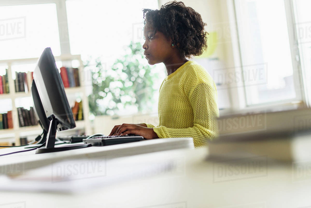 Black student using computer in classroom - Royalty-free Stock Photo ...