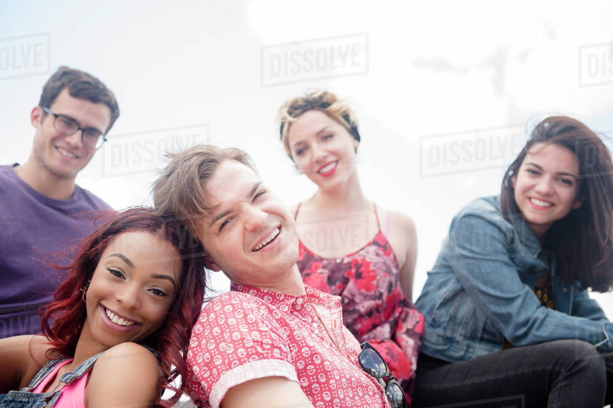 Portrait of smiling friends - Royalty-free Stock Photo | Dissolve