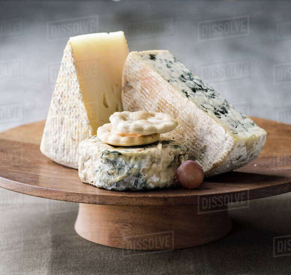 Wedges of cheese on tray - Stock Photo - Dissolve