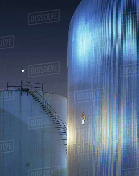 Staircase on storage tank at night - Royalty-free Stock Photo | Dissolve