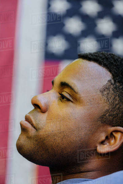 Profile of Black man in front of American flag - Royalty-free Stock ...