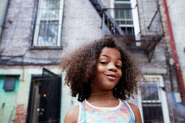 Portrait of smirking girl - Royalty-free Stock Photo | Dissolve