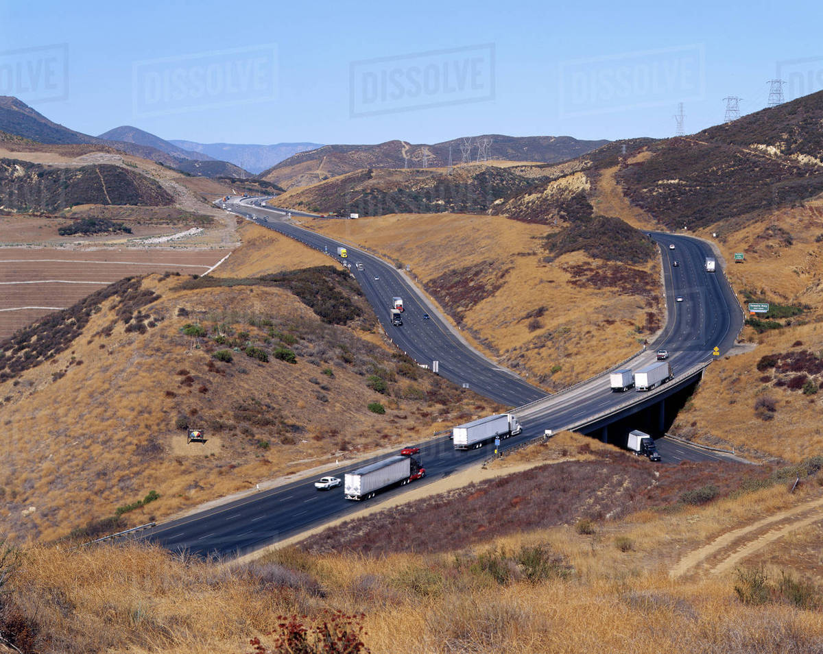 Trucks and cars driving on freeway overpass - Royalty-free Stock Photo ...