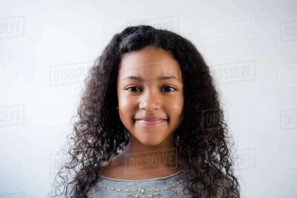 Portrait of smiling Mixed Race girl - Royalty-free Stock Photo | Dissolve