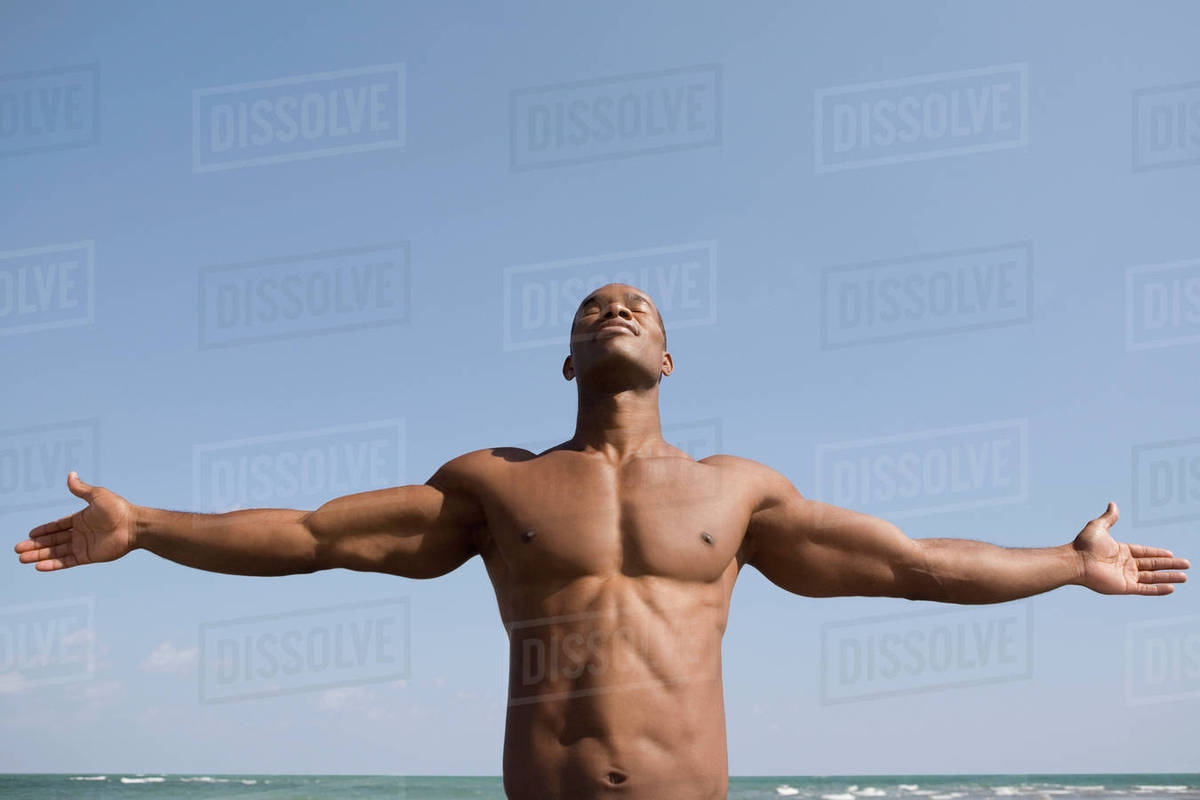Bare-chested man with arms outstretched - Royalty-free Stock Photo ...