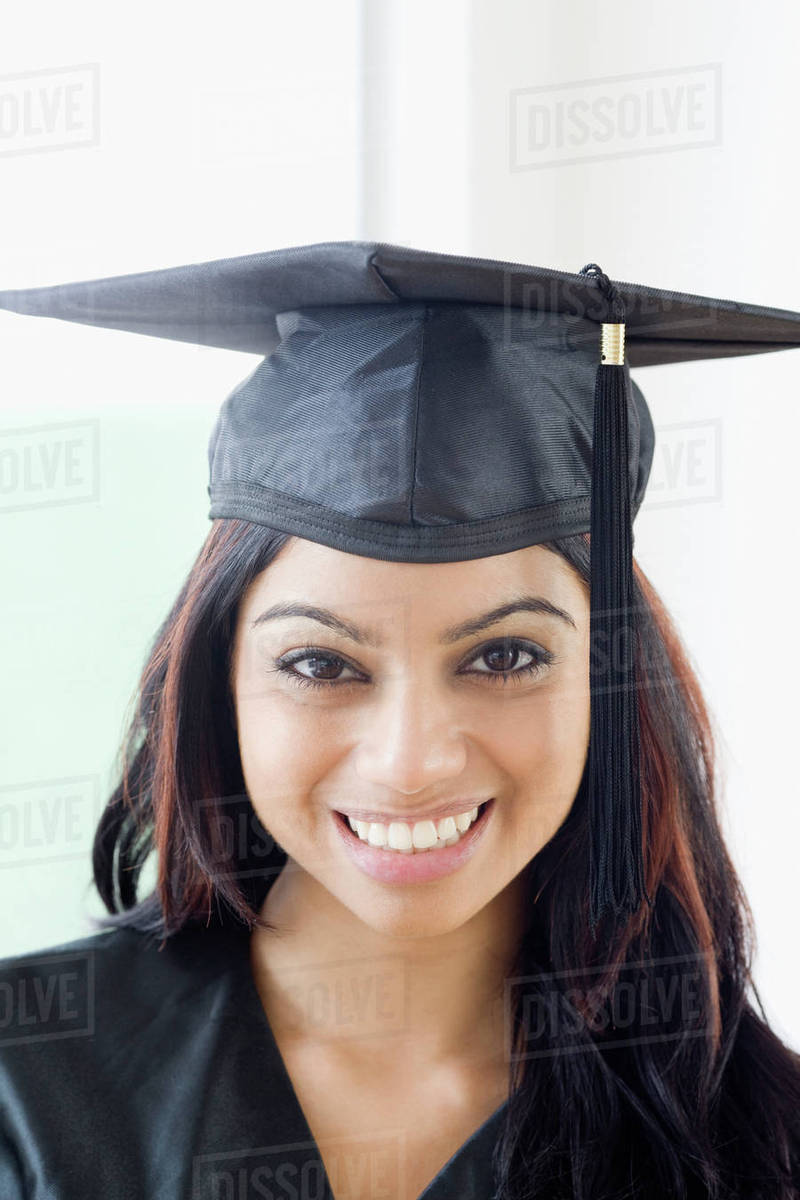 Mixed Race woman wearing graduation cap - Royalty-free Stock Photo ...