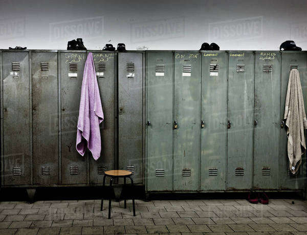 Towels hanging from lockers in locker room - Royalty-free Stock Photo ...