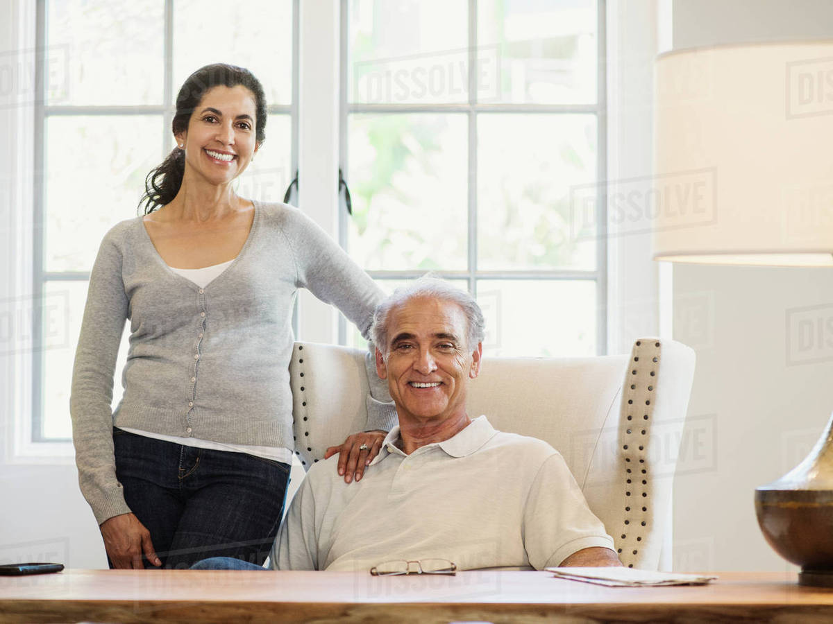 Portrait of couple posing near window - Royalty-free Stock Photo | Dissolve