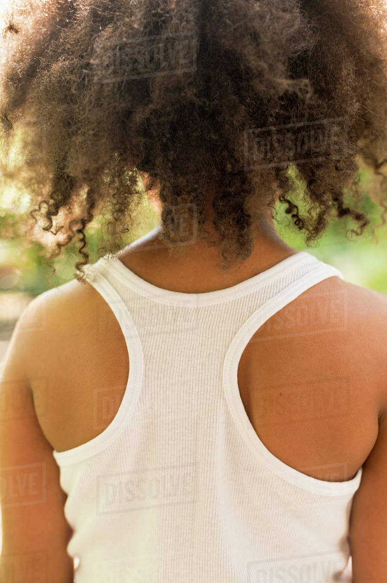 Rear view of Black girl - Royalty-free Stock Photo | Dissolve
