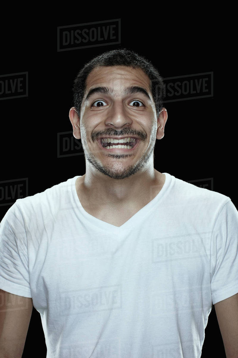 Portrait of excited man smiling - Royalty-free Stock Photo | Dissolve