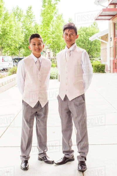 Hispanic boys wearing suits - Stock Photo - Dissolve