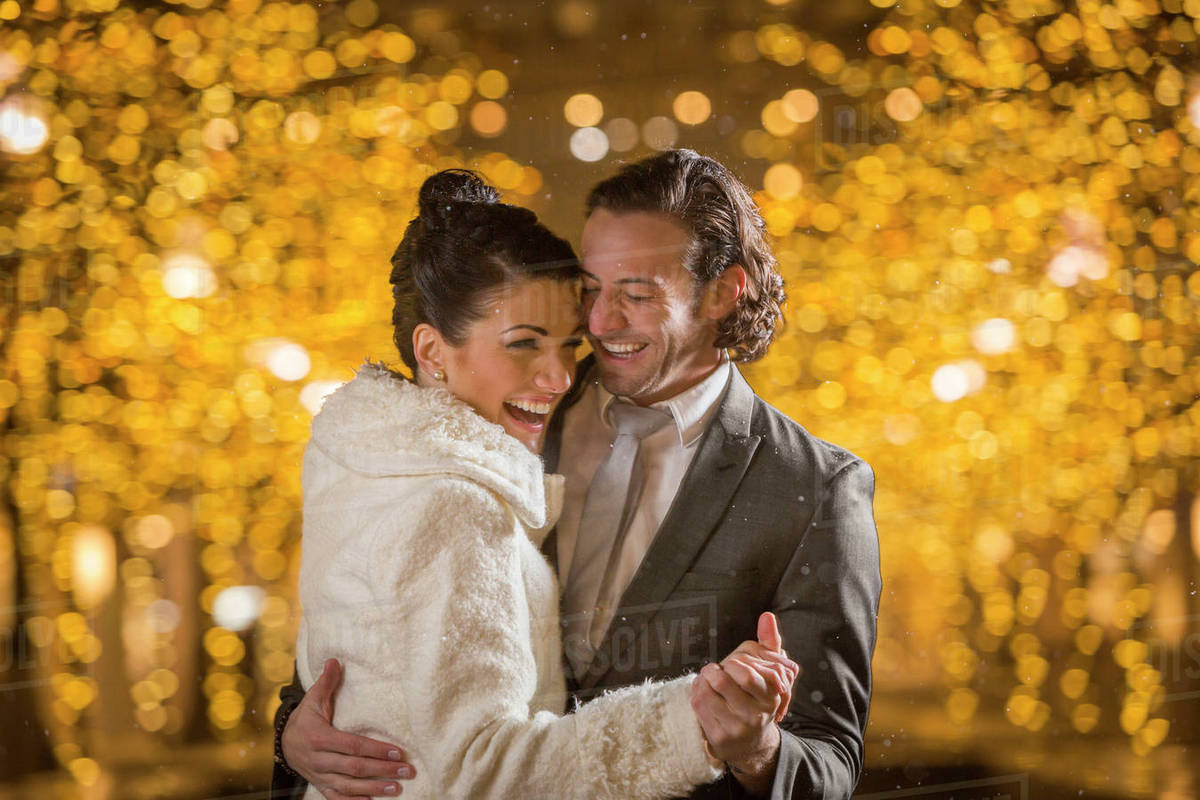 Caucasian couple dancing outdoors at night - Royalty-free Stock Photo ...