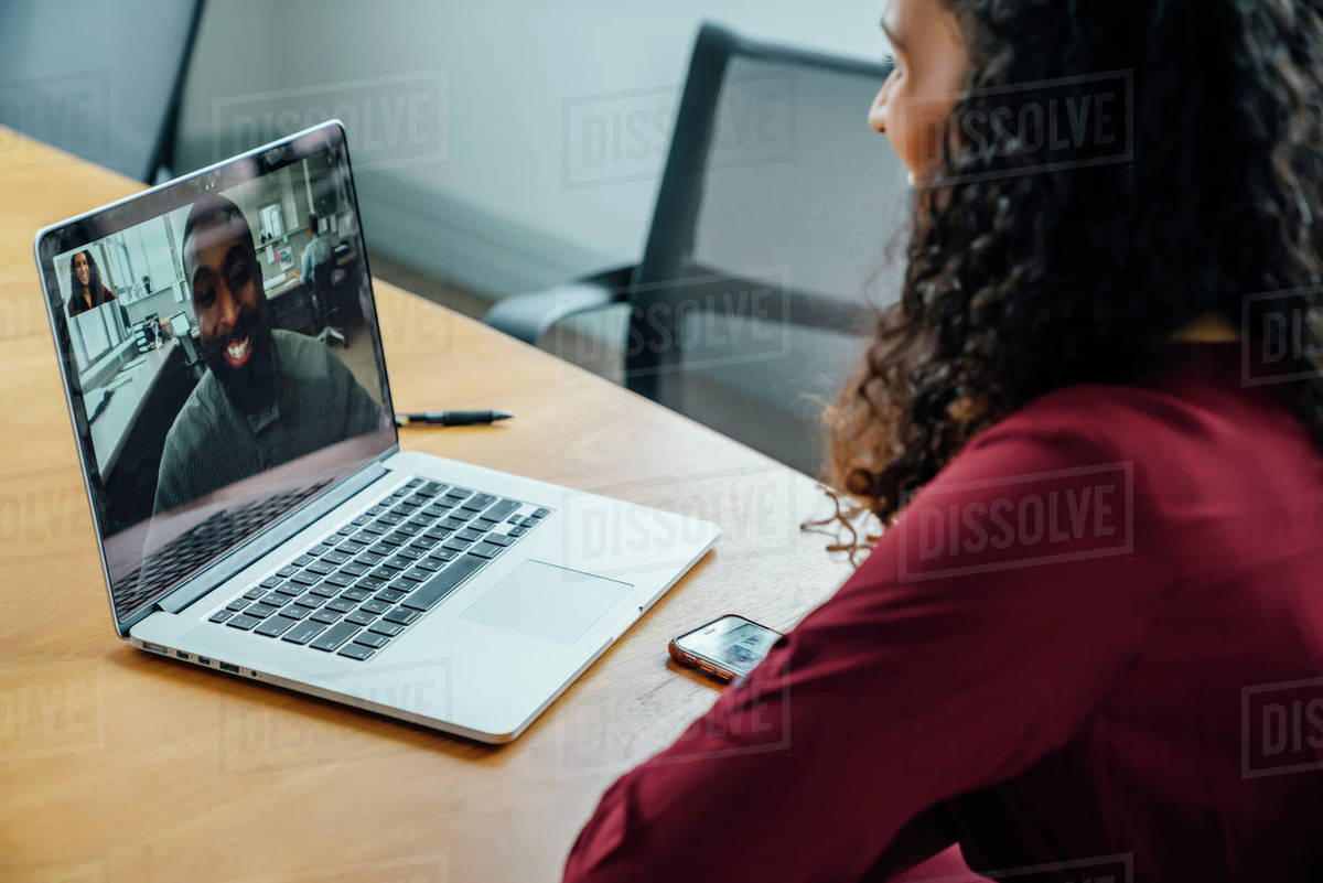 Business people on video conference - Stock Photo - Dissolve