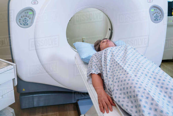 Caucasian patient laying on scanner table - Royalty-free Stock Photo ...