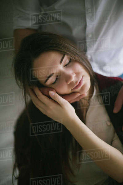 Caucasian man caressing face of woman - Royalty-free Stock Photo | Dissolve