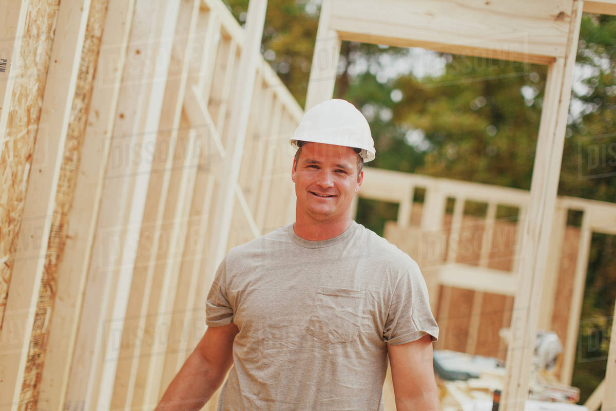 Caucasian construction worker smiling on site - Royalty-free Stock ...
