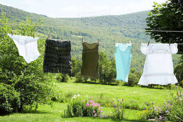 Clothesline in rural backyard - Stock Photo - Dissolve