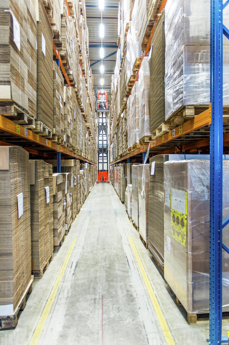 Packed pallets on shelves in warehouse - Royalty-free Stock Photo ...