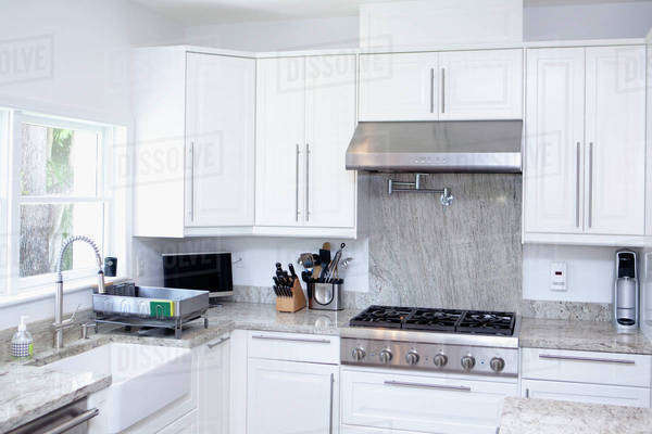 Stove, cabinets and sink in modern kitchen - Royalty-free Stock Photo ...